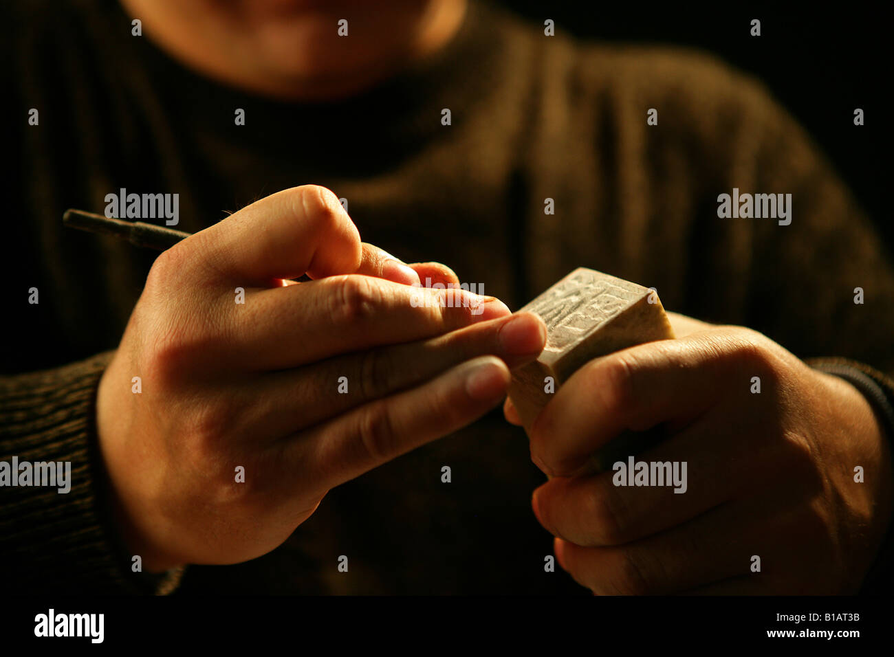 Man hands carving traditional chop hi-res stock photography and images ...