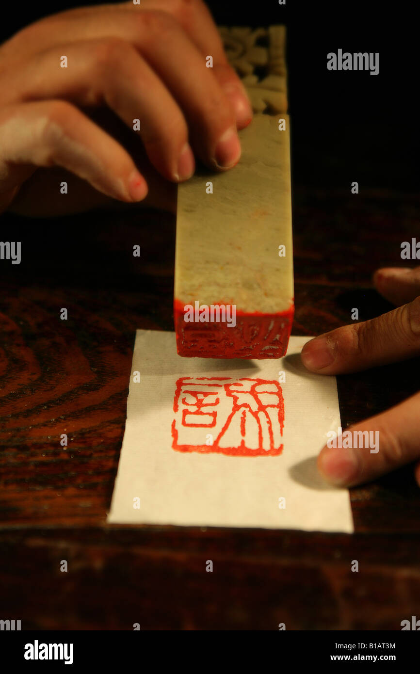 China,man's hands touching traditional chop print,close-up Stock Photo ...