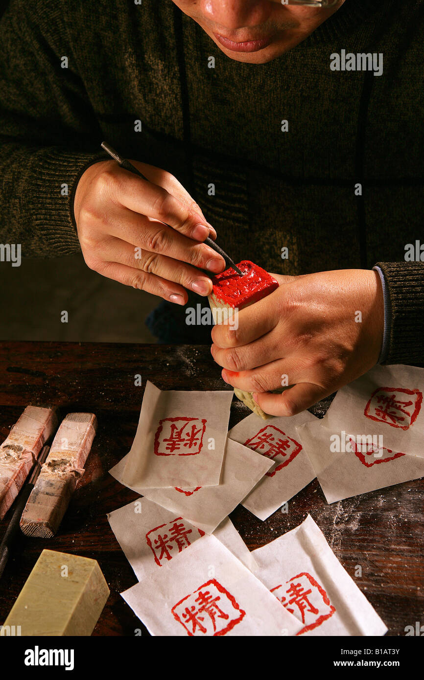 China,man's hands touching traditional chop print,close-up Stock Photo ...