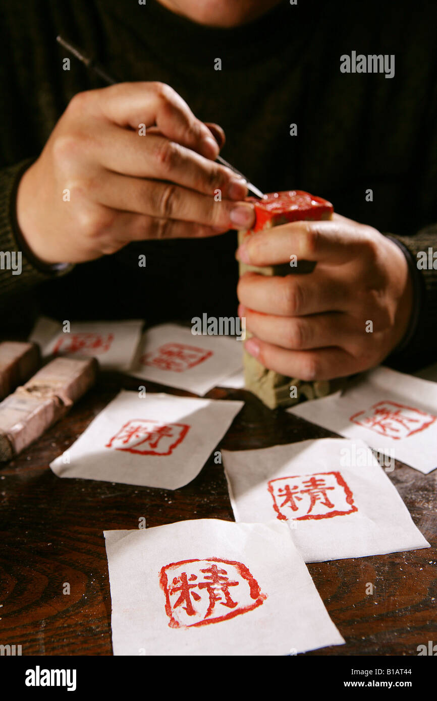 China,man's hands touching traditional chop print,close-up Stock Photo ...