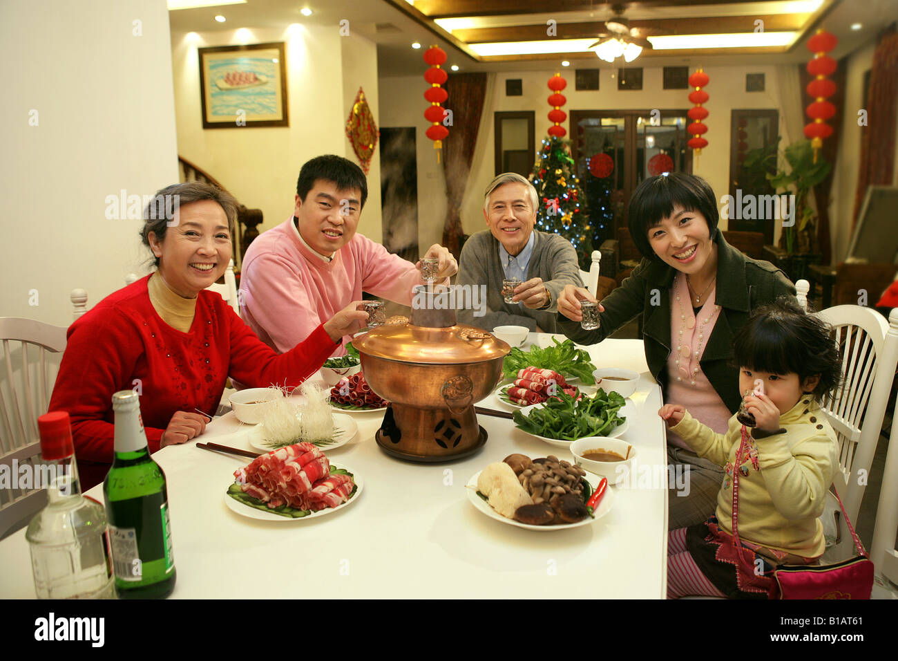 Chinese family at dinner table Stock Photo - Alamy