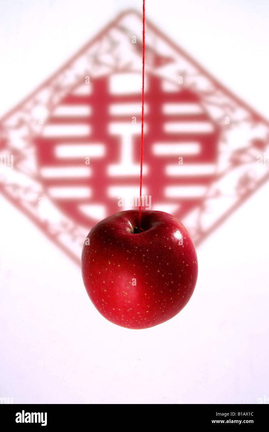a hanging red apple Stock Photo - Alamy
