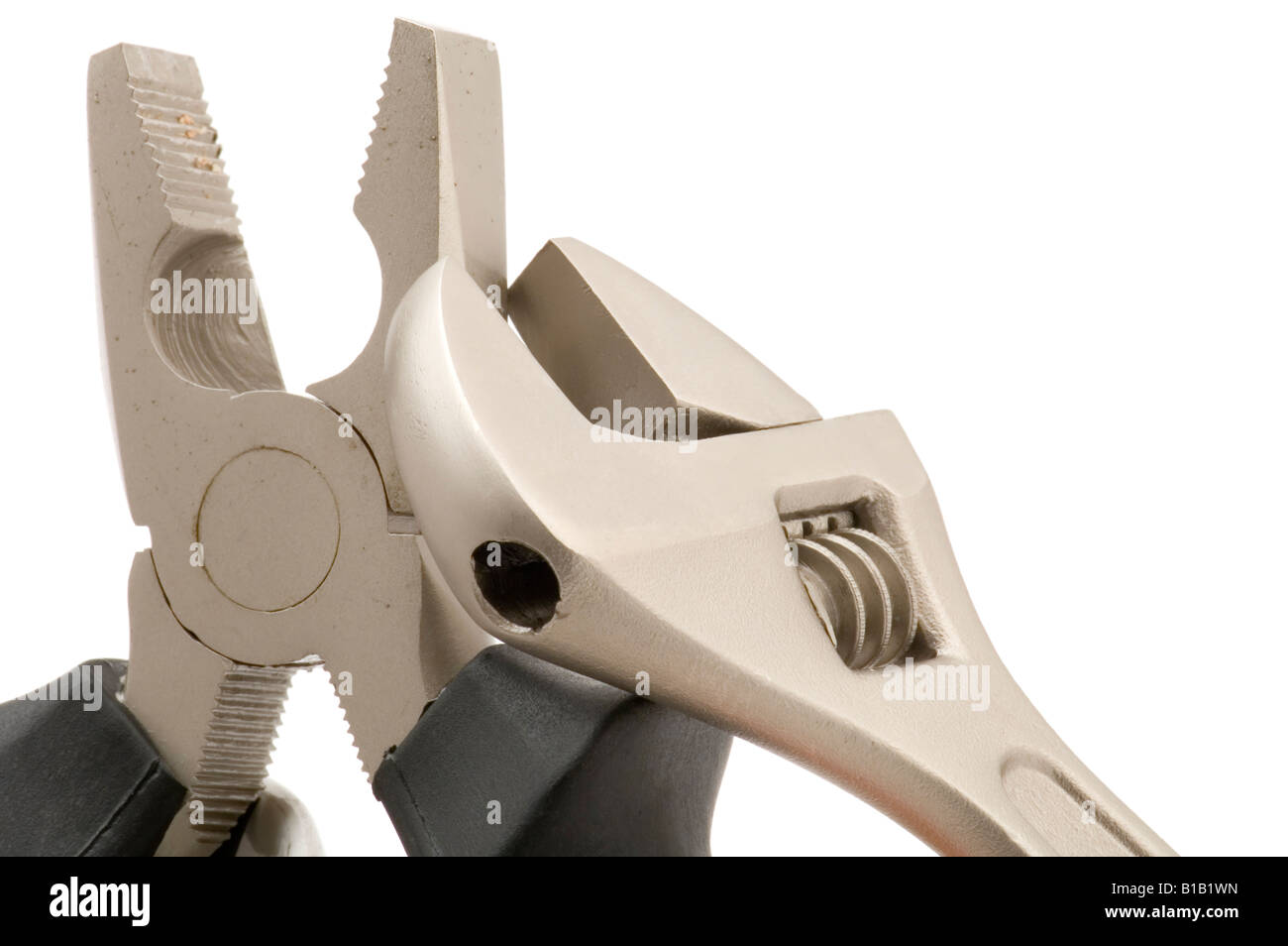 object on white tool monkey wrench with pliers Stock Photo - Alamy