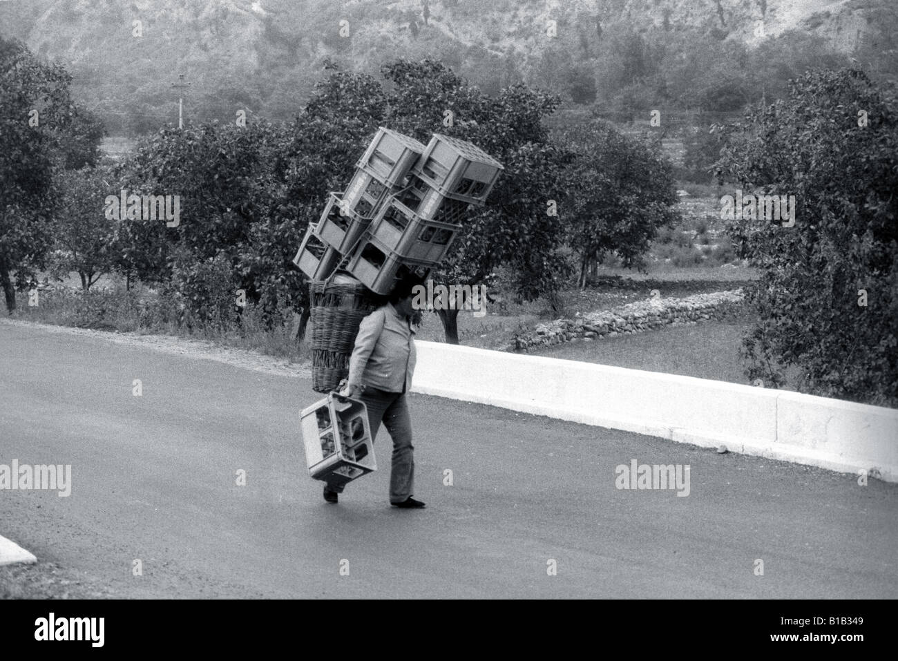 farmer walking with many boxes Stock Photo - Alamy