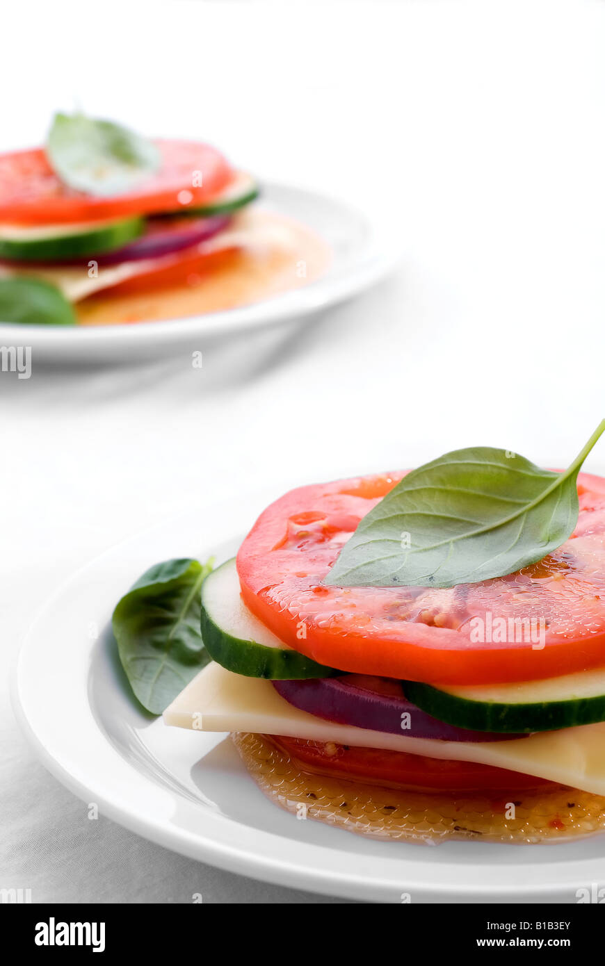 Garden vegetable stacks on white plates Stock Photo - Alamy