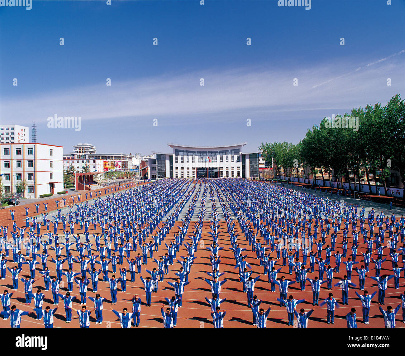 students doing exercise on playground Stock Photo - Alamy