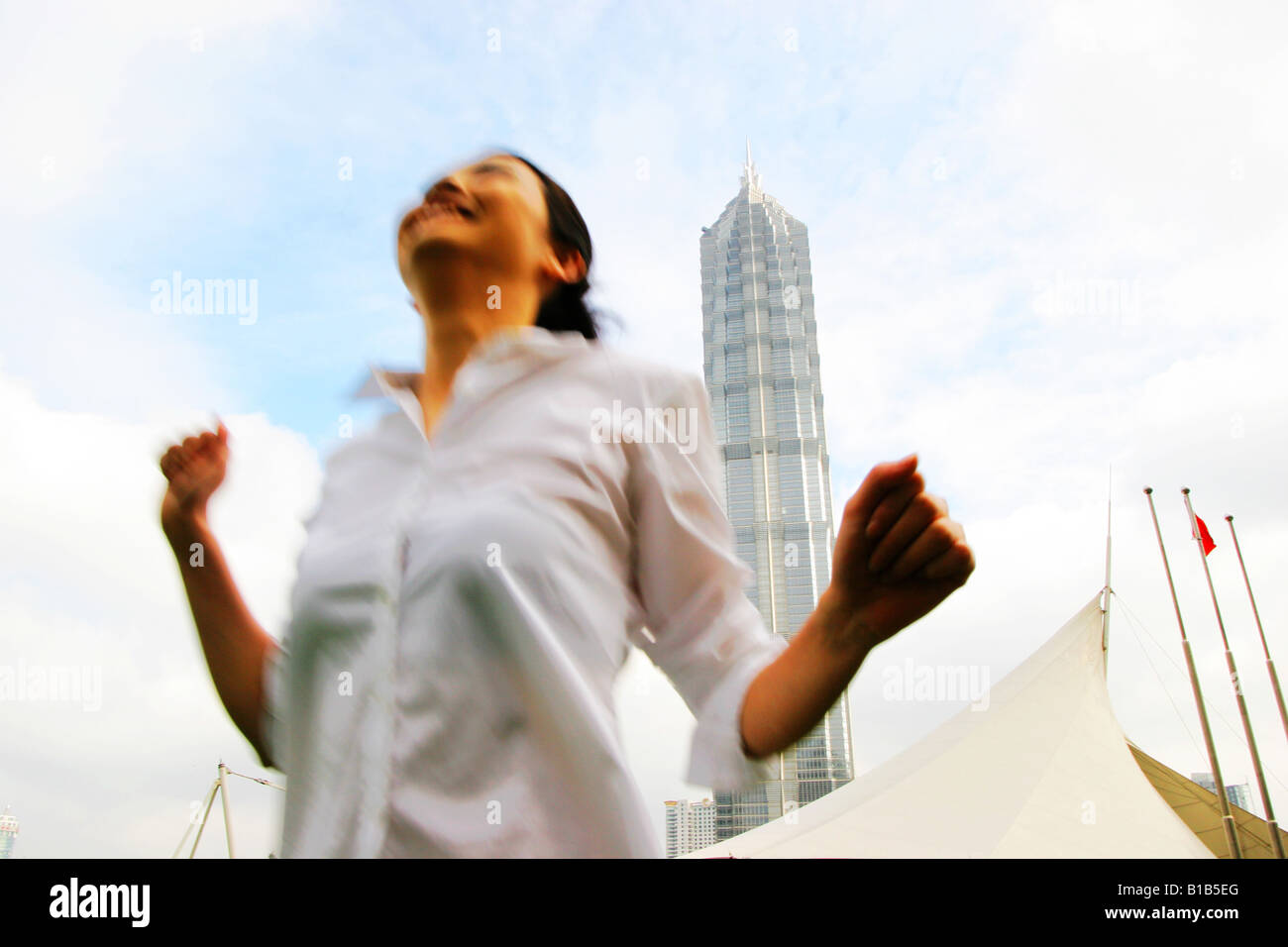 Businesswoman jumping under jinmao tower hi-res stock photography and ...