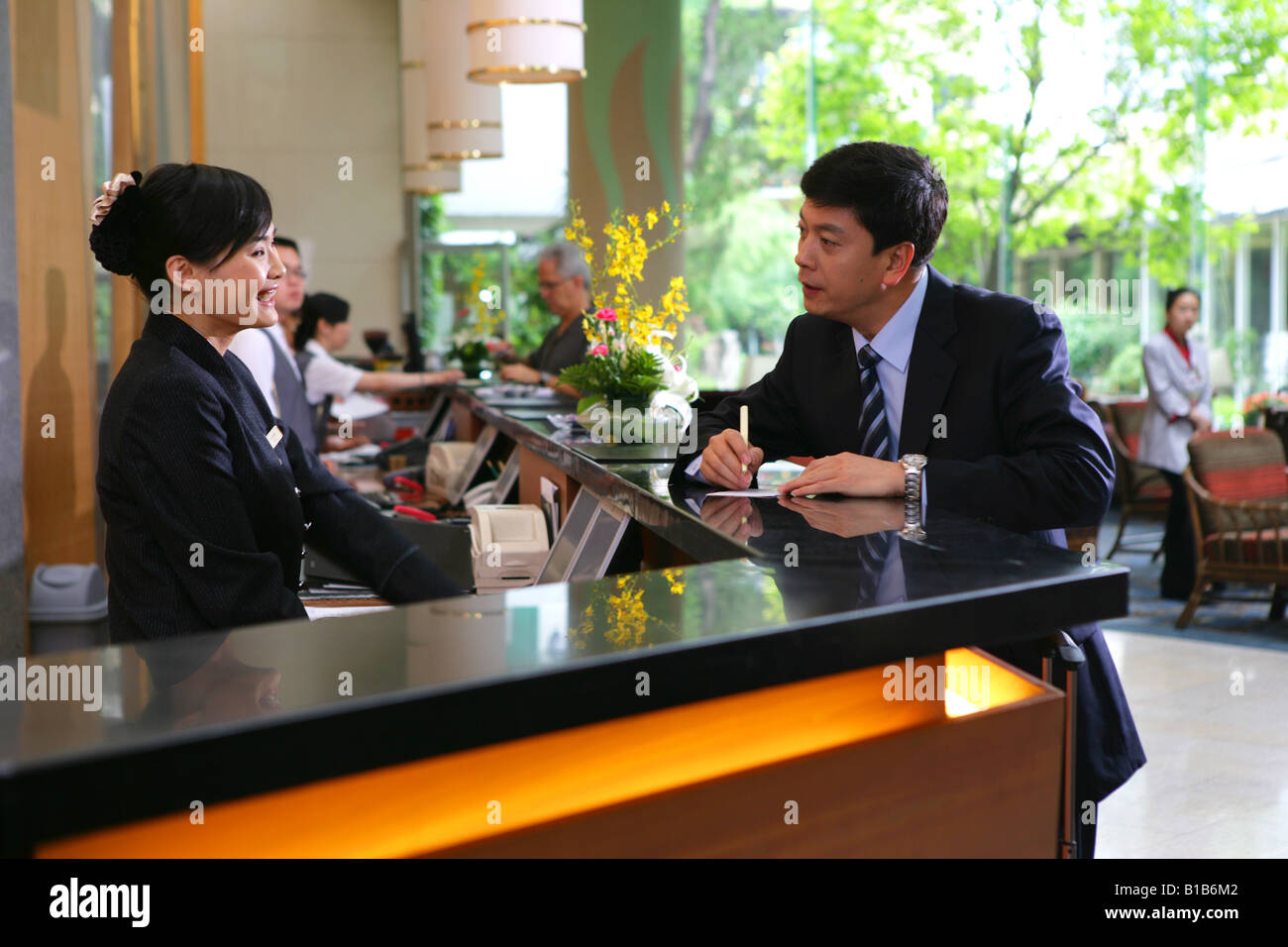 Chinese female receptionist using hi-res stock photography and images ...