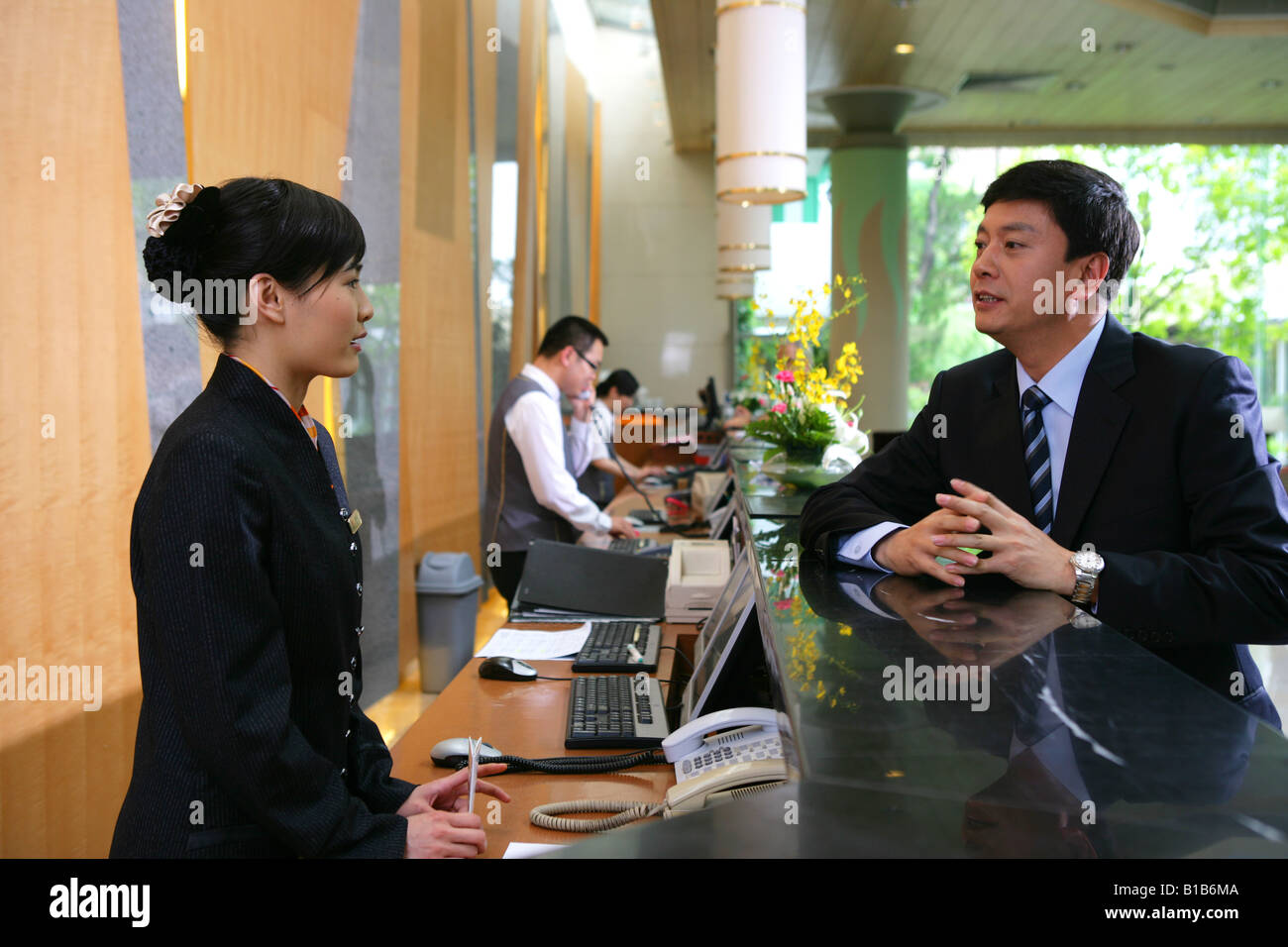 Chinese female receptionist using hi-res stock photography and images ...