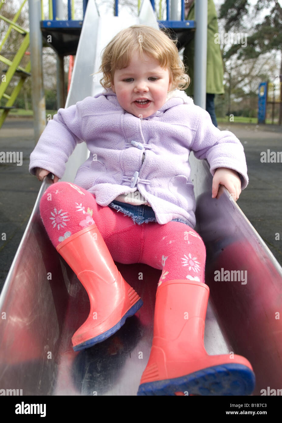 Girl on slide Stock Photo - Alamy