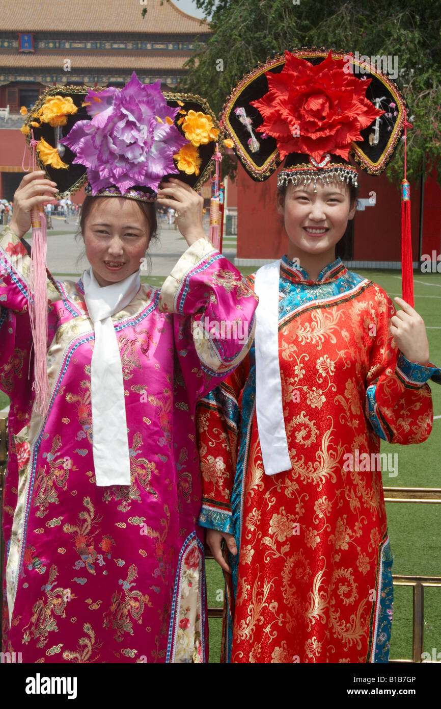 Young women dressed in traditional costume posing for pictures, Beijing ...