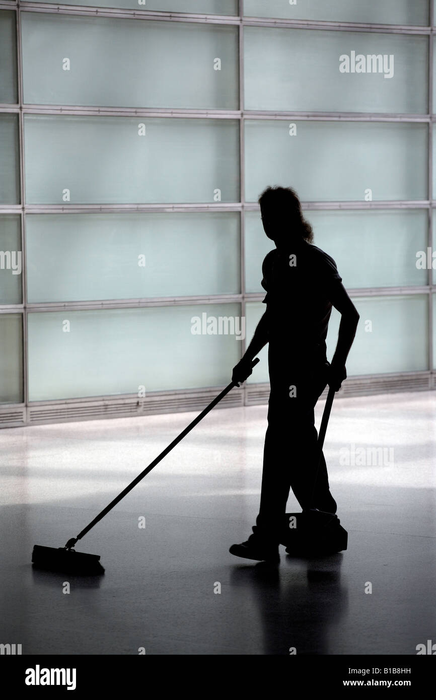 Man with a broom hi-res stock photography and images - Alamy