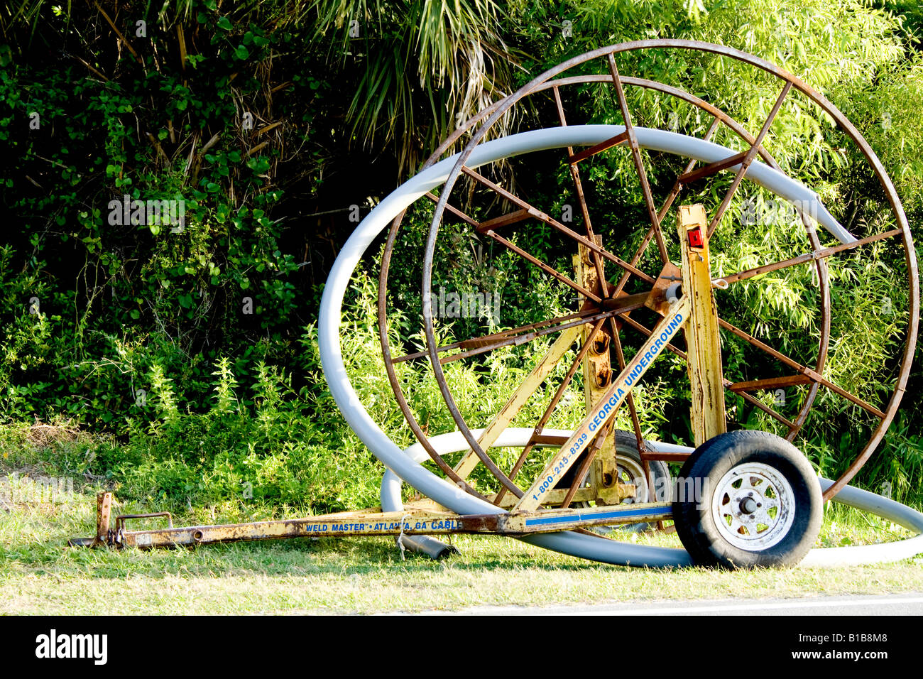 Almost empty PVC pipe large metal spool on small wheels in Ponte Vedra ...