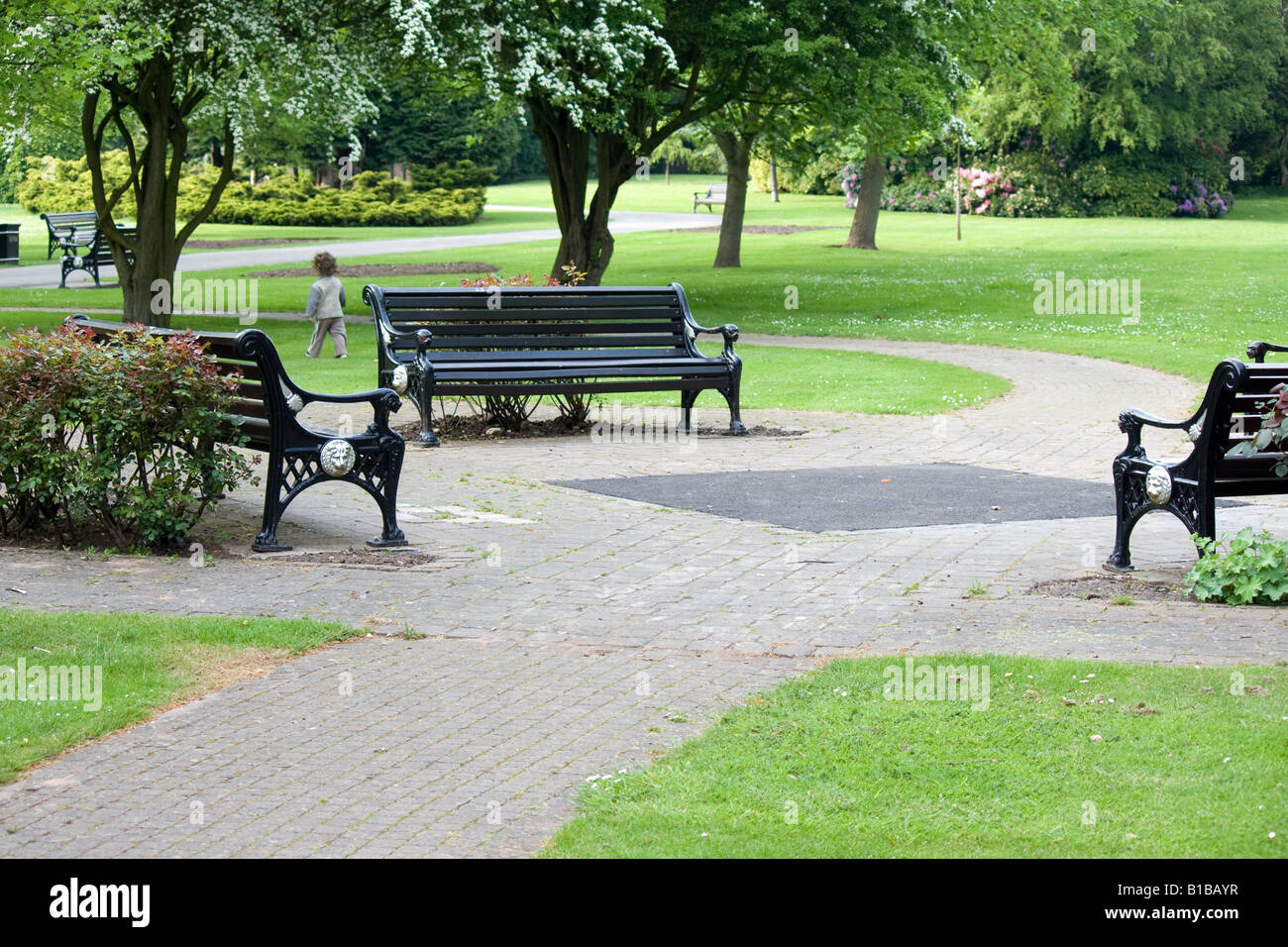 Path leading to park benches Stock Photo - Alamy