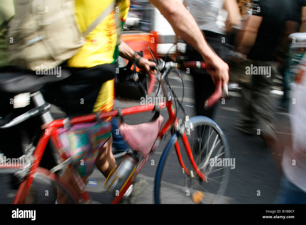person riding fast bike in street in city town Stock Photo - Alamy