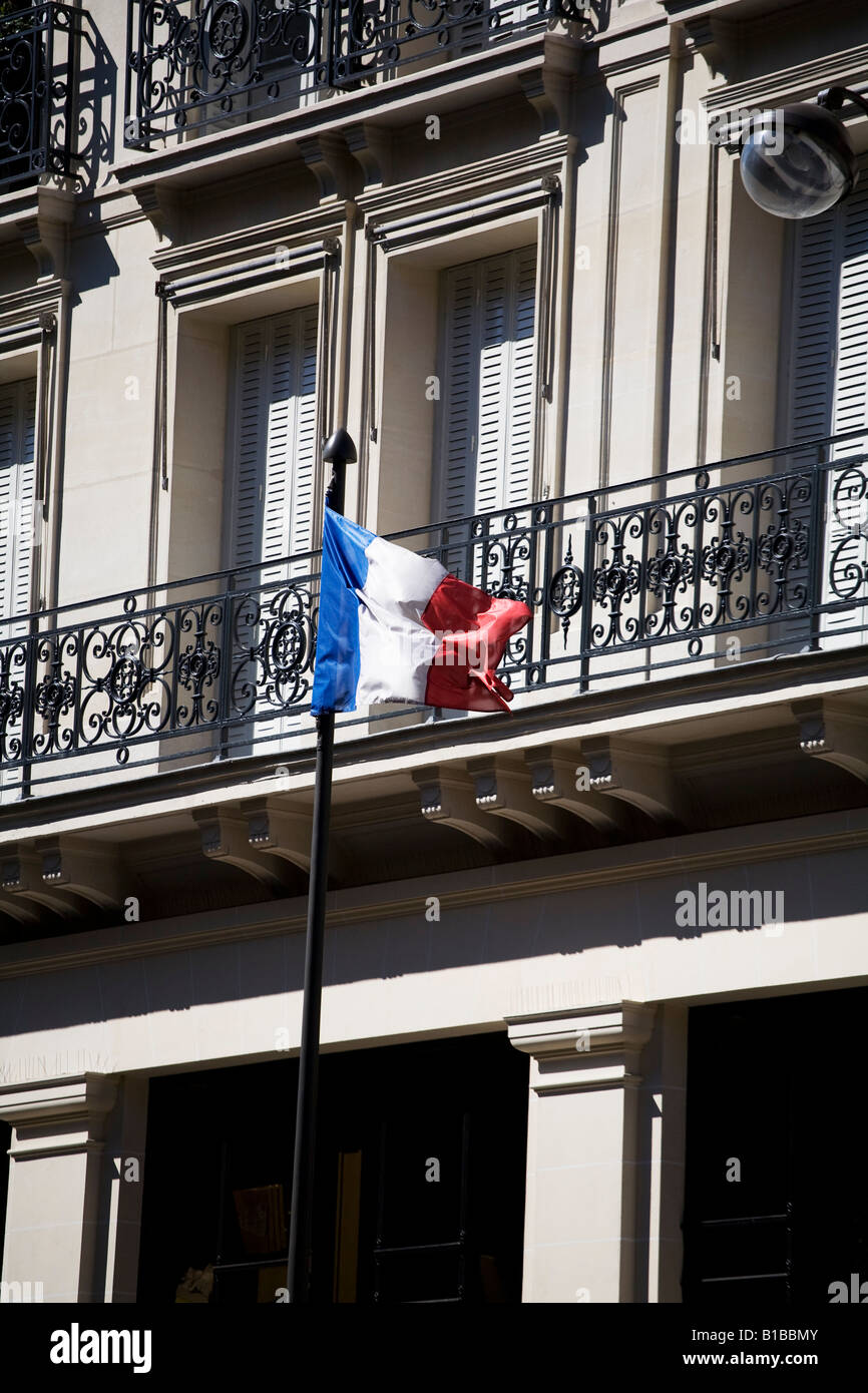 French Flag in front of a building in Paris Stock Photo - Alamy