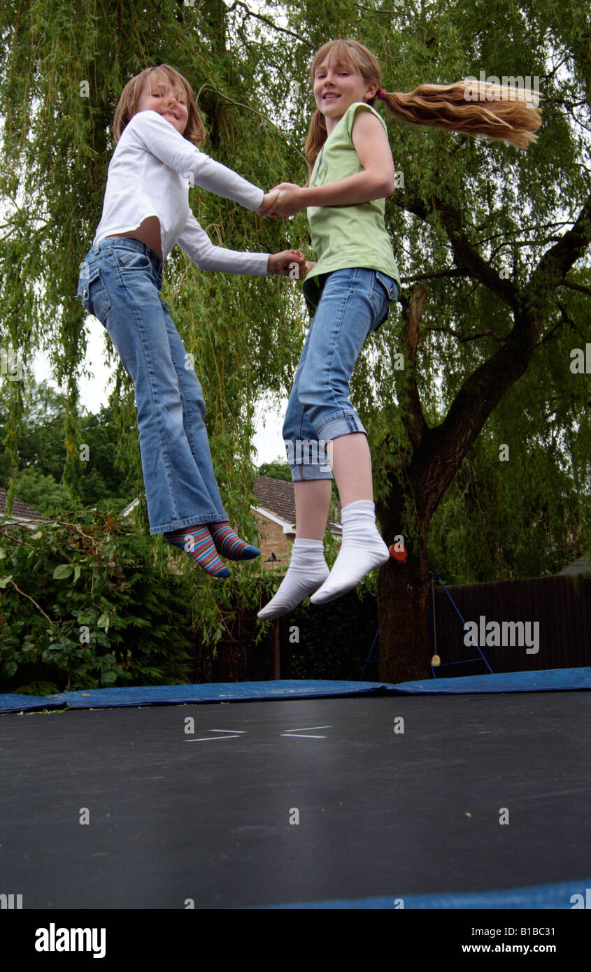 Children playing on trampoline Stock Photo - Alamy