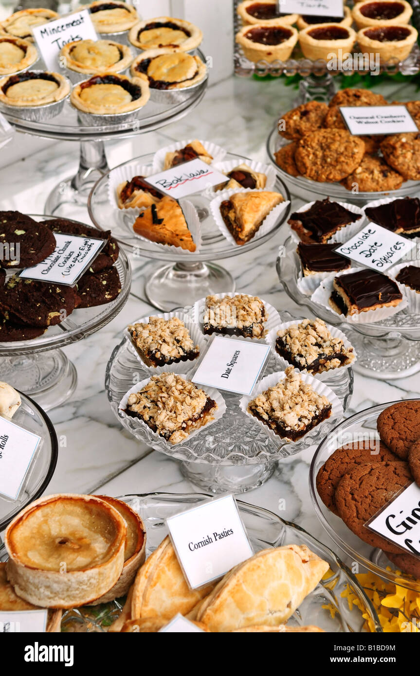 Various desserts on display in bakery window Stock Photo - Alamy