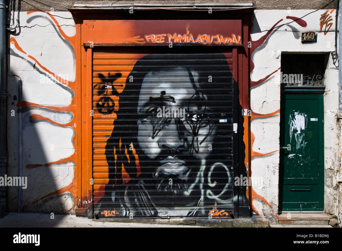 Graffiti mural sprayed onto shop window shutter, Poitiers, Vienne ...