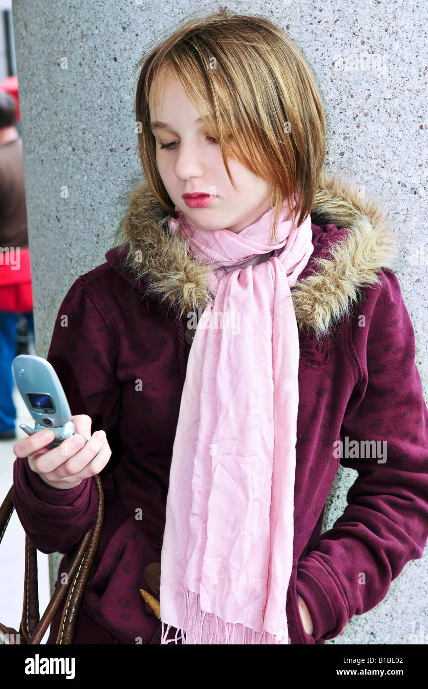 Teenage girl text messaging on cell phone Stock Photo - Alamy