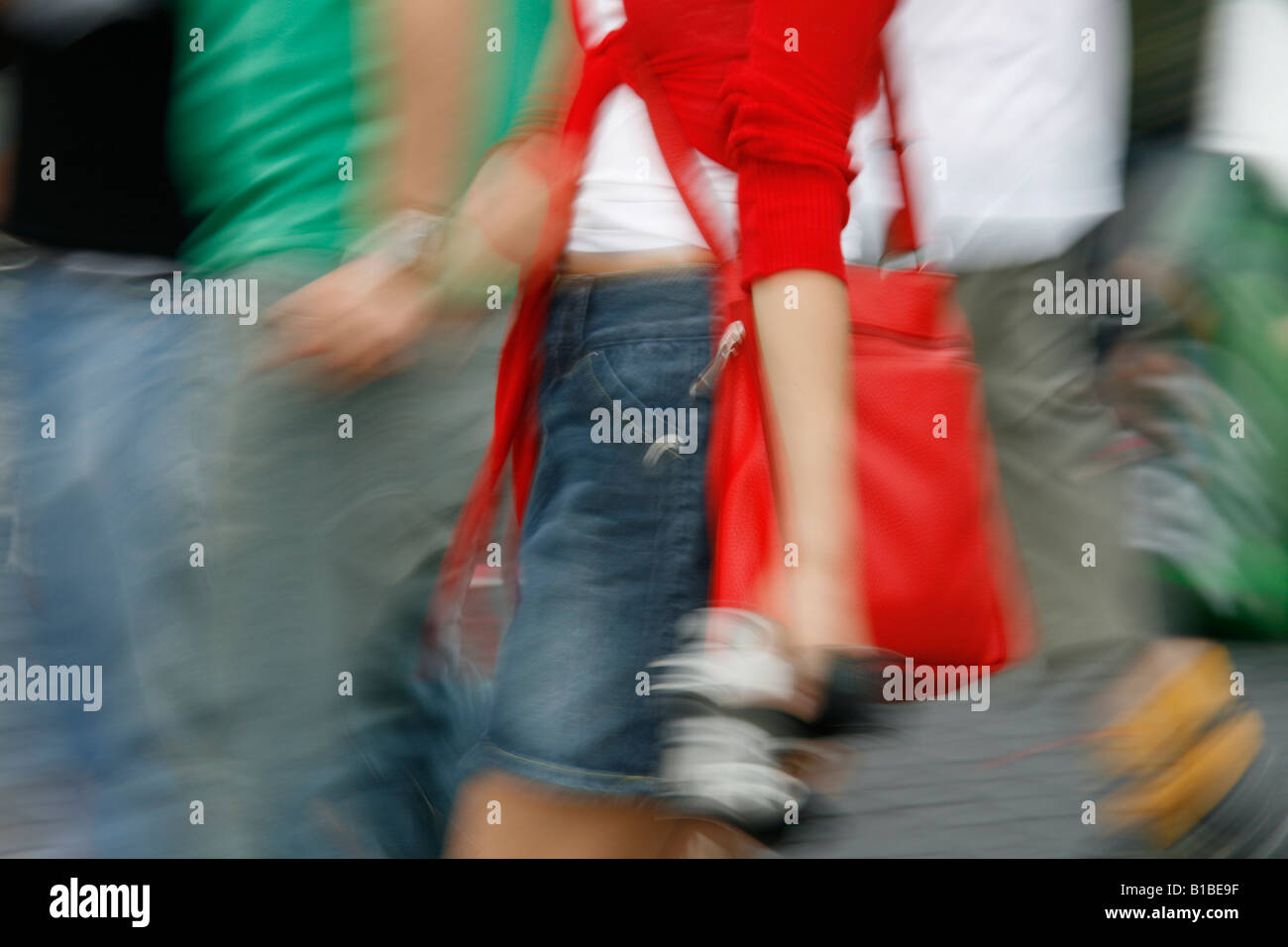 woman with red handbag running in town Stock Photo - Alamy