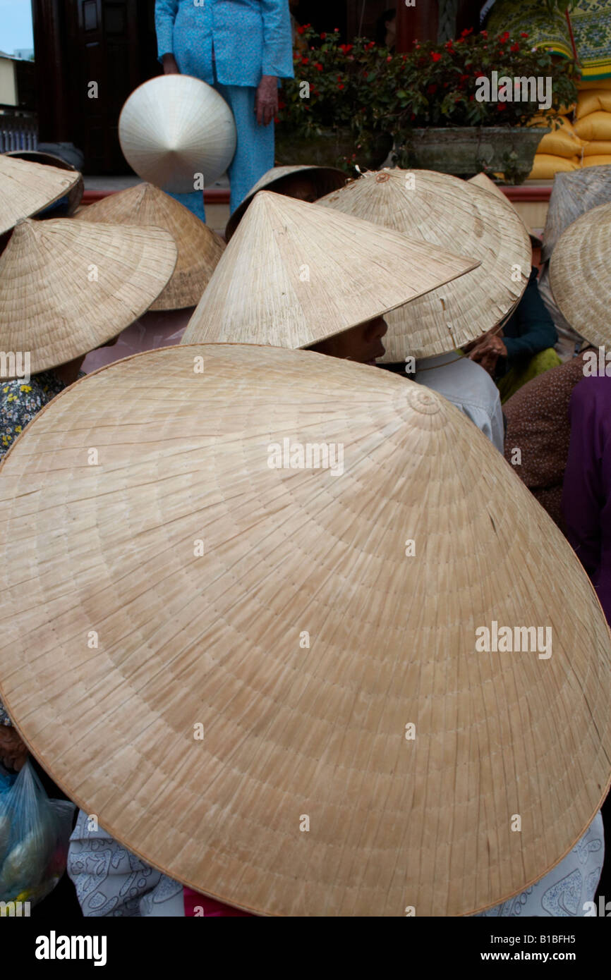 Women wearing traditional cone shaped hats, Hoi An, Vietnam Stock Photo ...