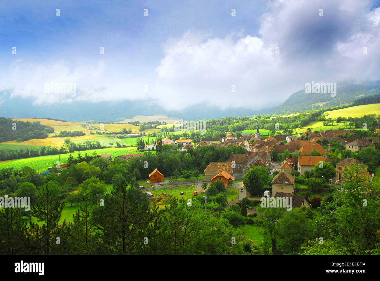 Rural landscape with hills and village in eastern France Stock Photo ...