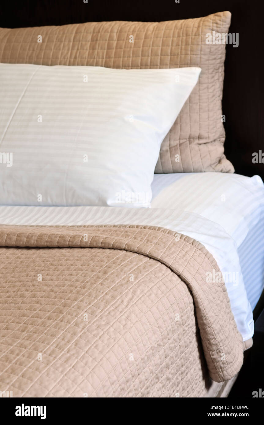 Comfortable bed in upscale hotel close up Stock Photo - Alamy