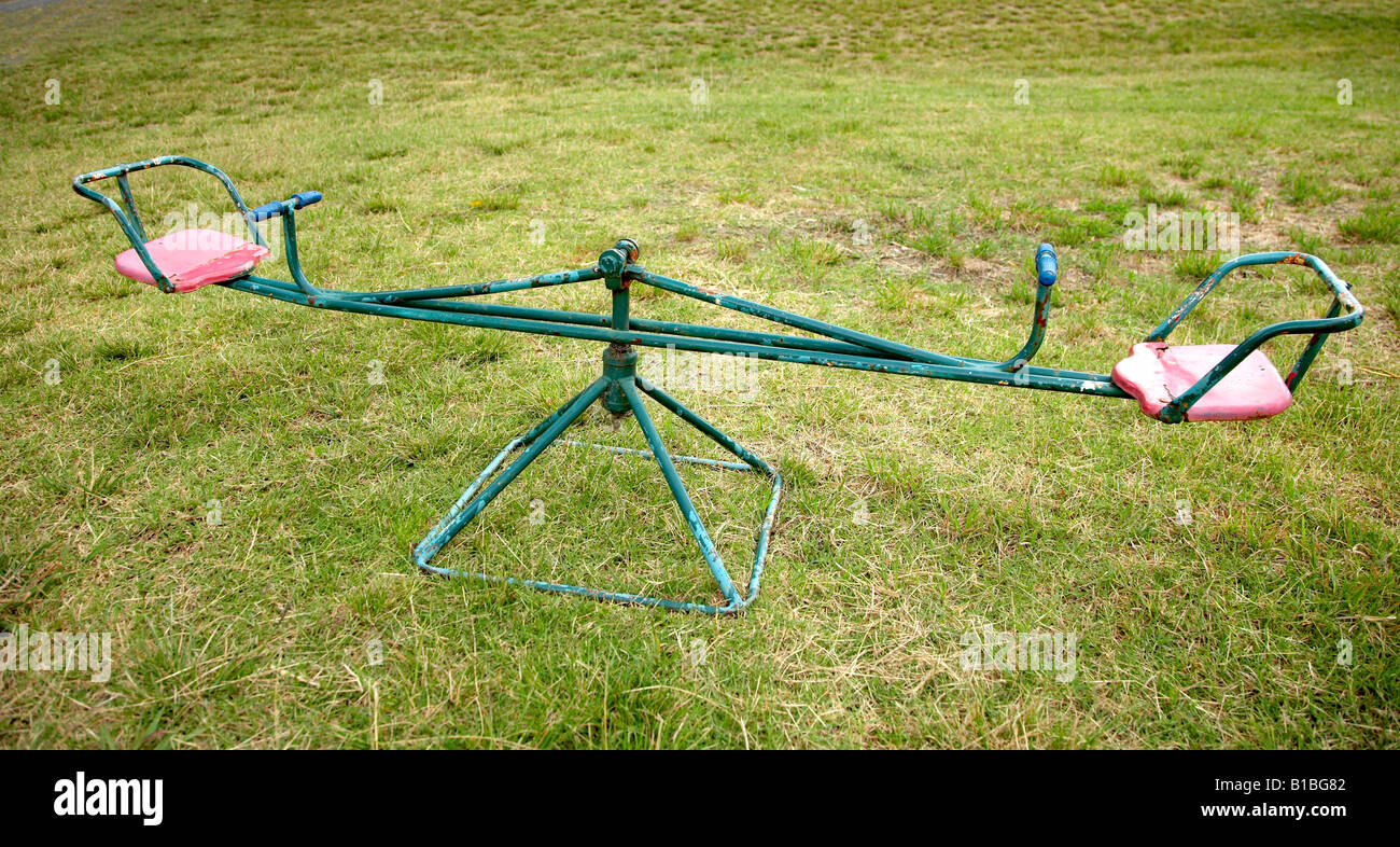 old rustic see saw in playground Stock Photo - Alamy