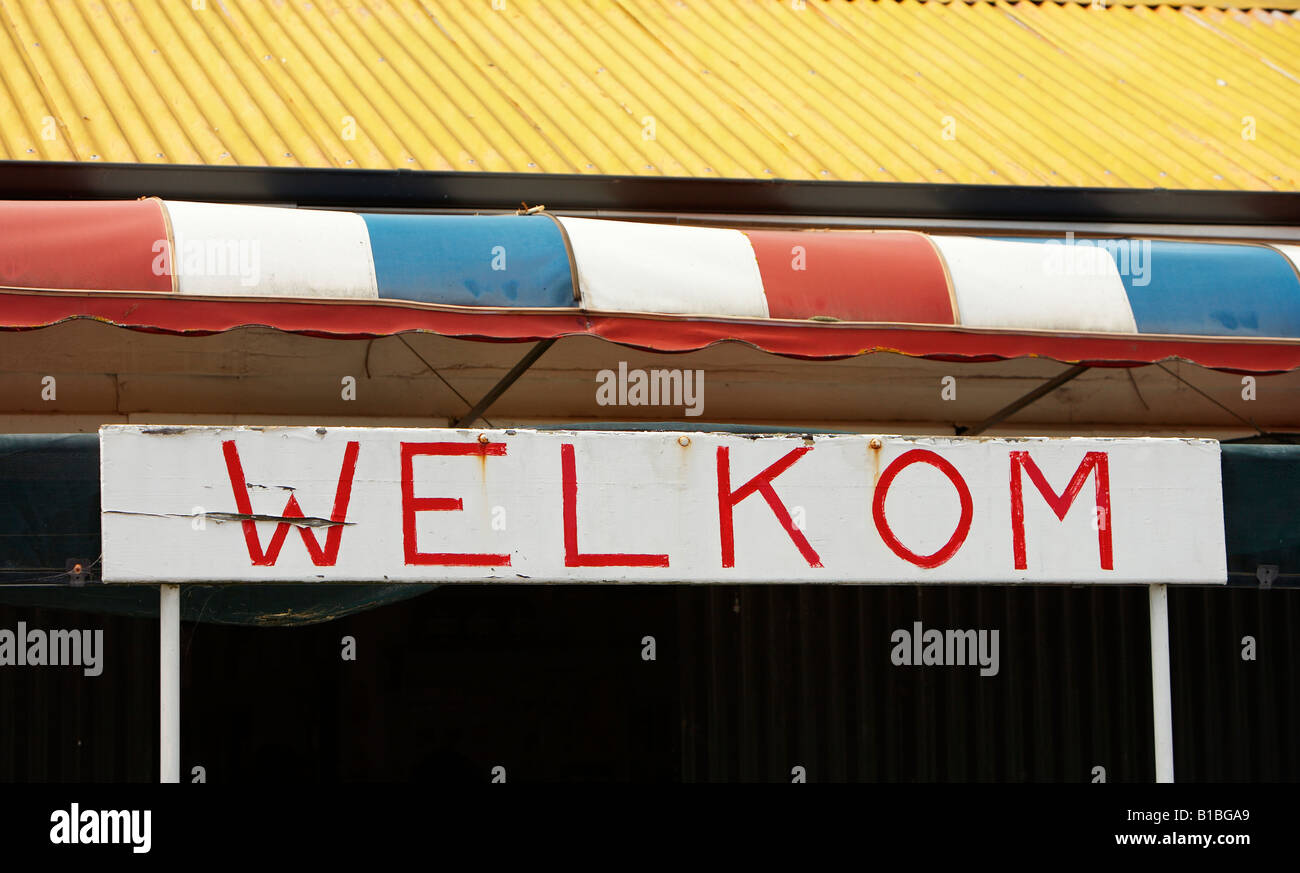 dutch welcome hand written sign above shop Stock Photo - Alamy