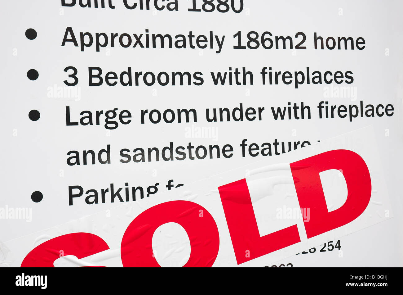 Real estate for sale board with sold sticker Stock Photo - Alamy