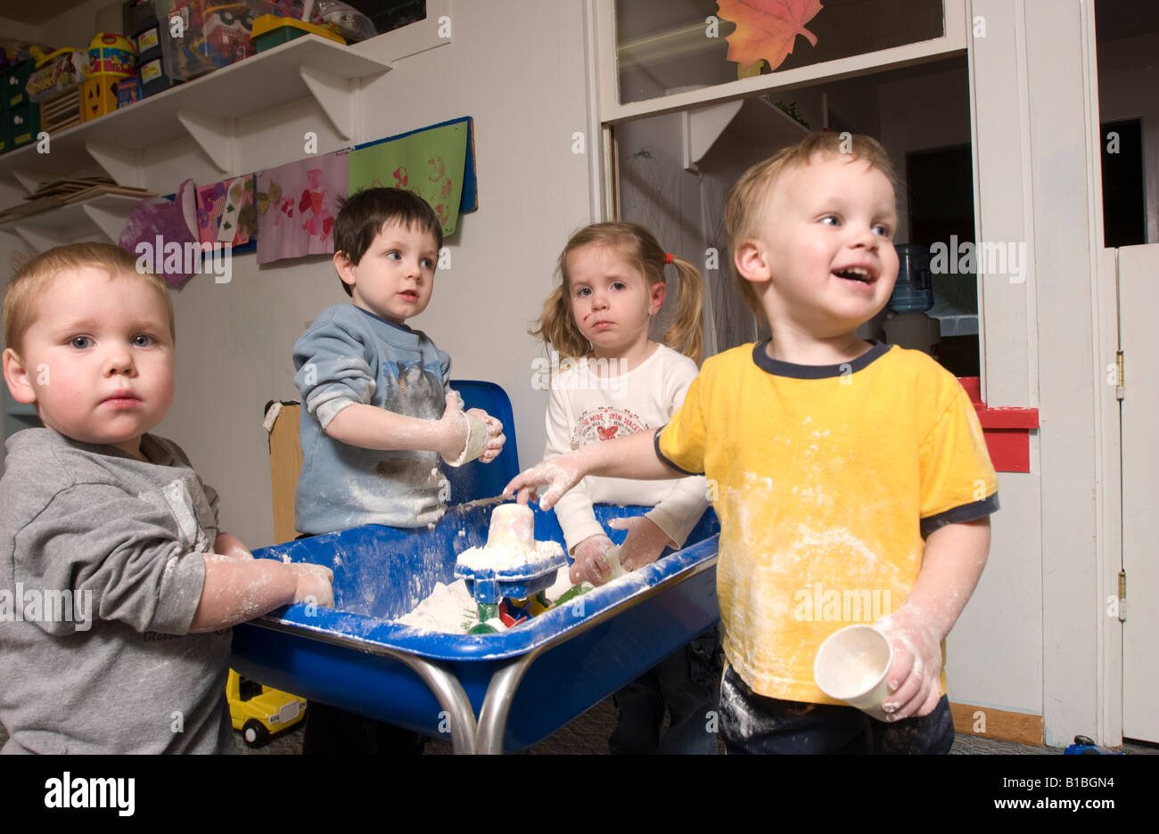 Preschool kids playing in flour Stock Photo - Alamy