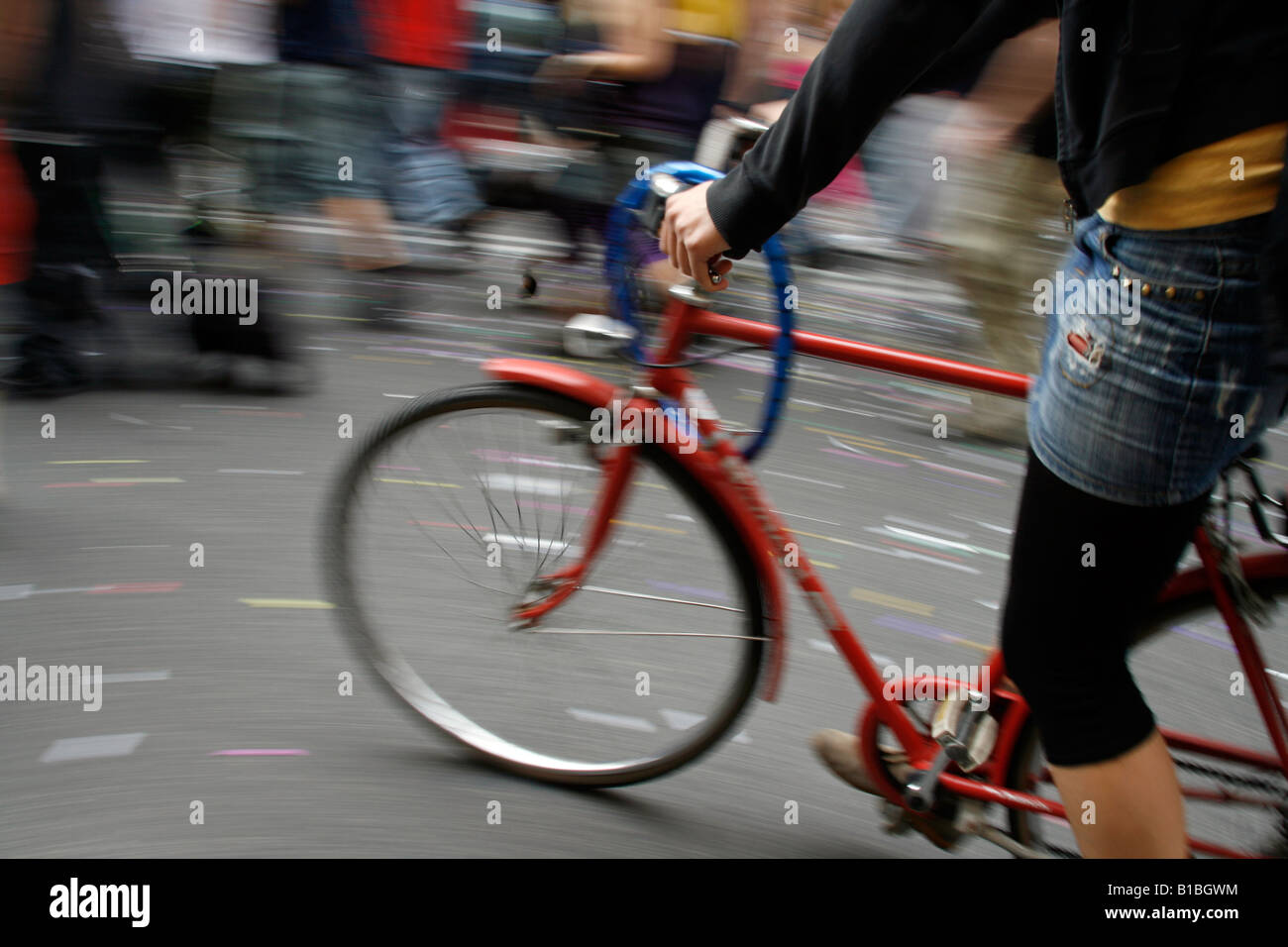 person riding fast bike in street in city town Stock Photo - Alamy