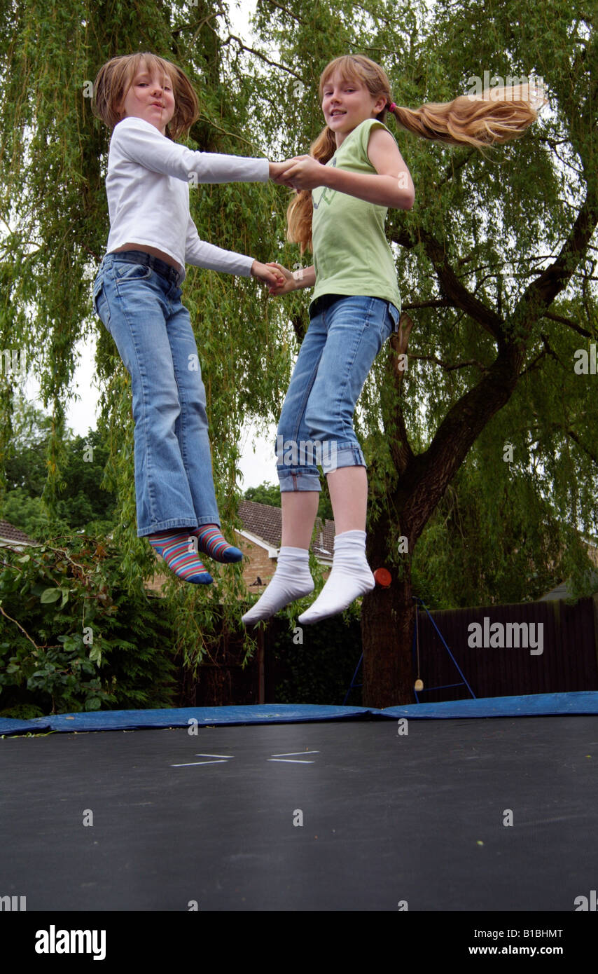 Children playing on trampoline Stock Photo - Alamy