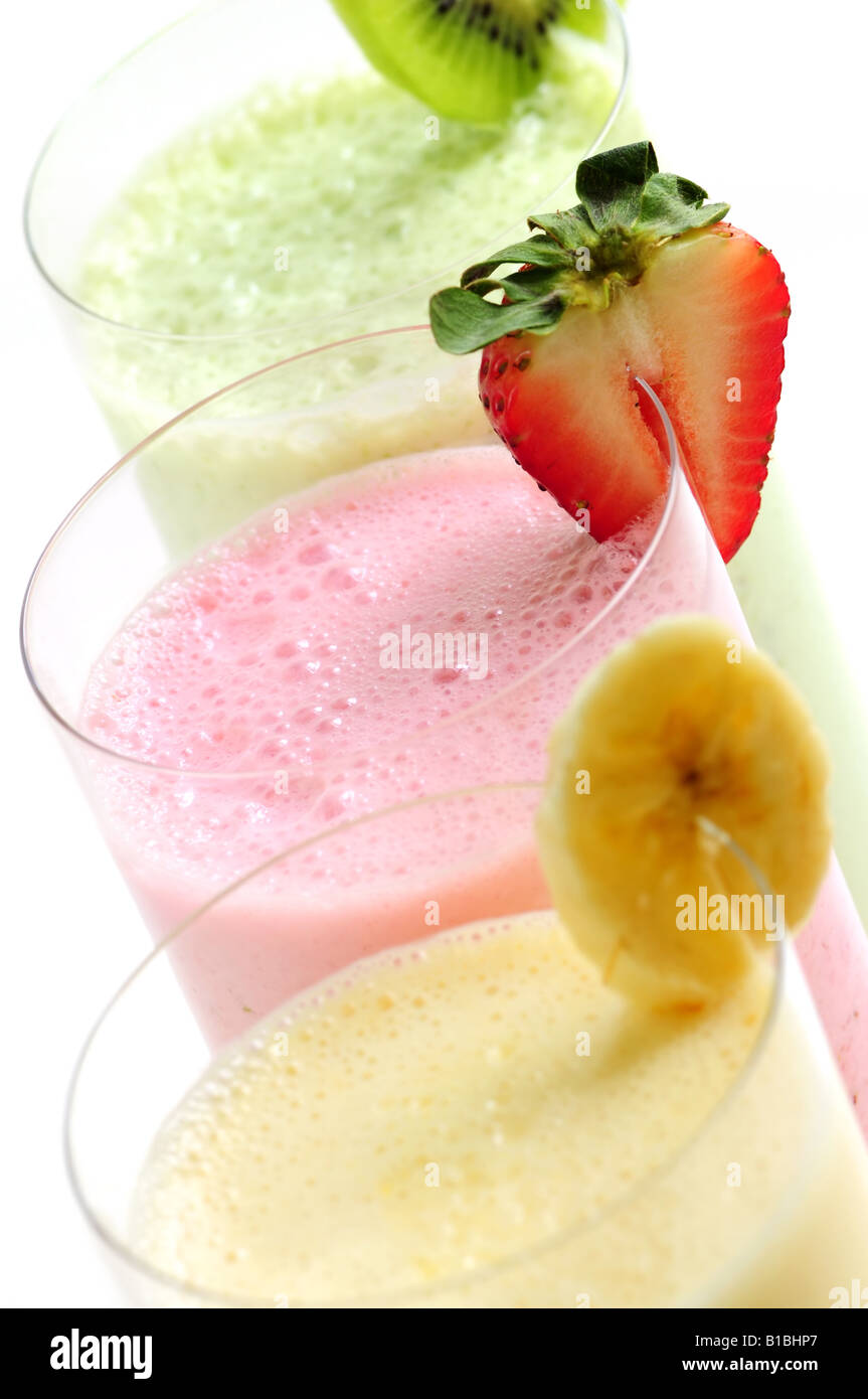 Assorted fruit smoothies close up on white background Stock Photo - Alamy