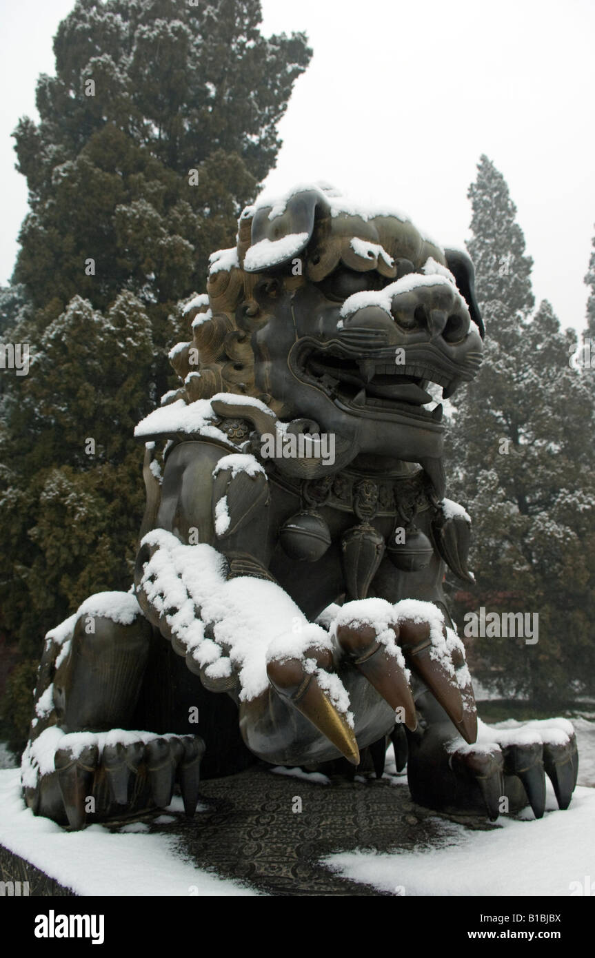 a lion statue covered in snow after a winter snowfall Fragrant Hills ...