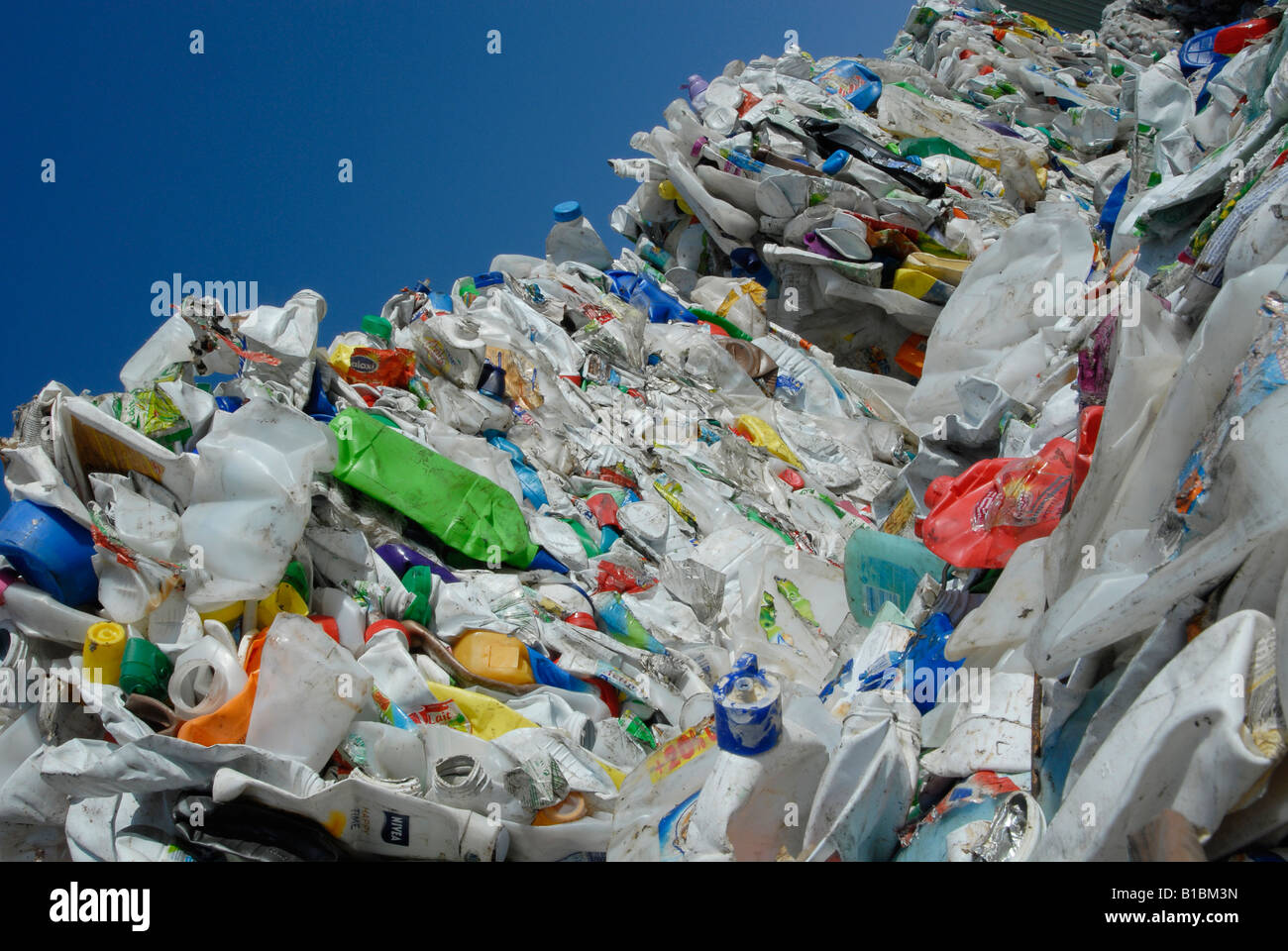 Stacks of bales of waste plastic bottles awaiting recycling Stock Photo ...