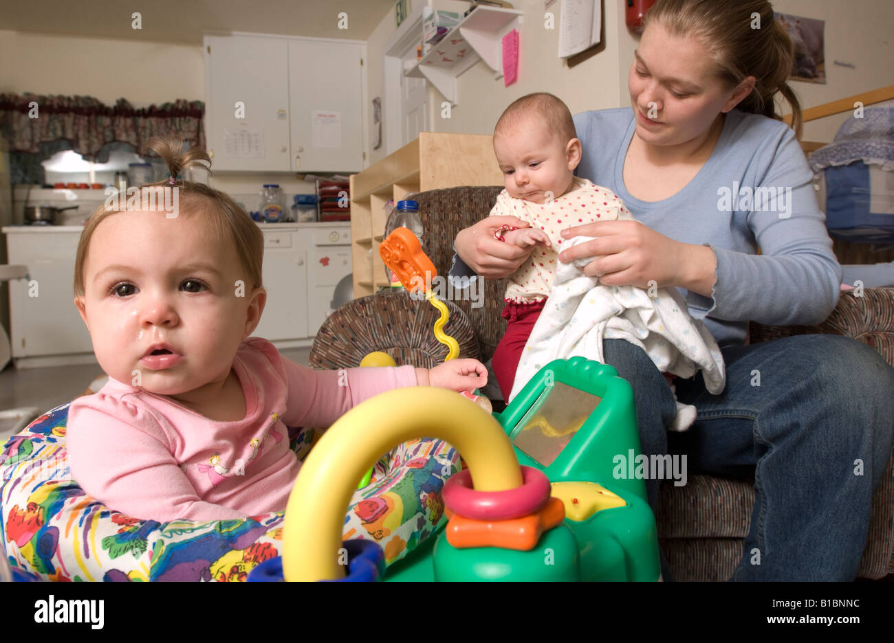 Childcare worker with children Stock Photo - Alamy