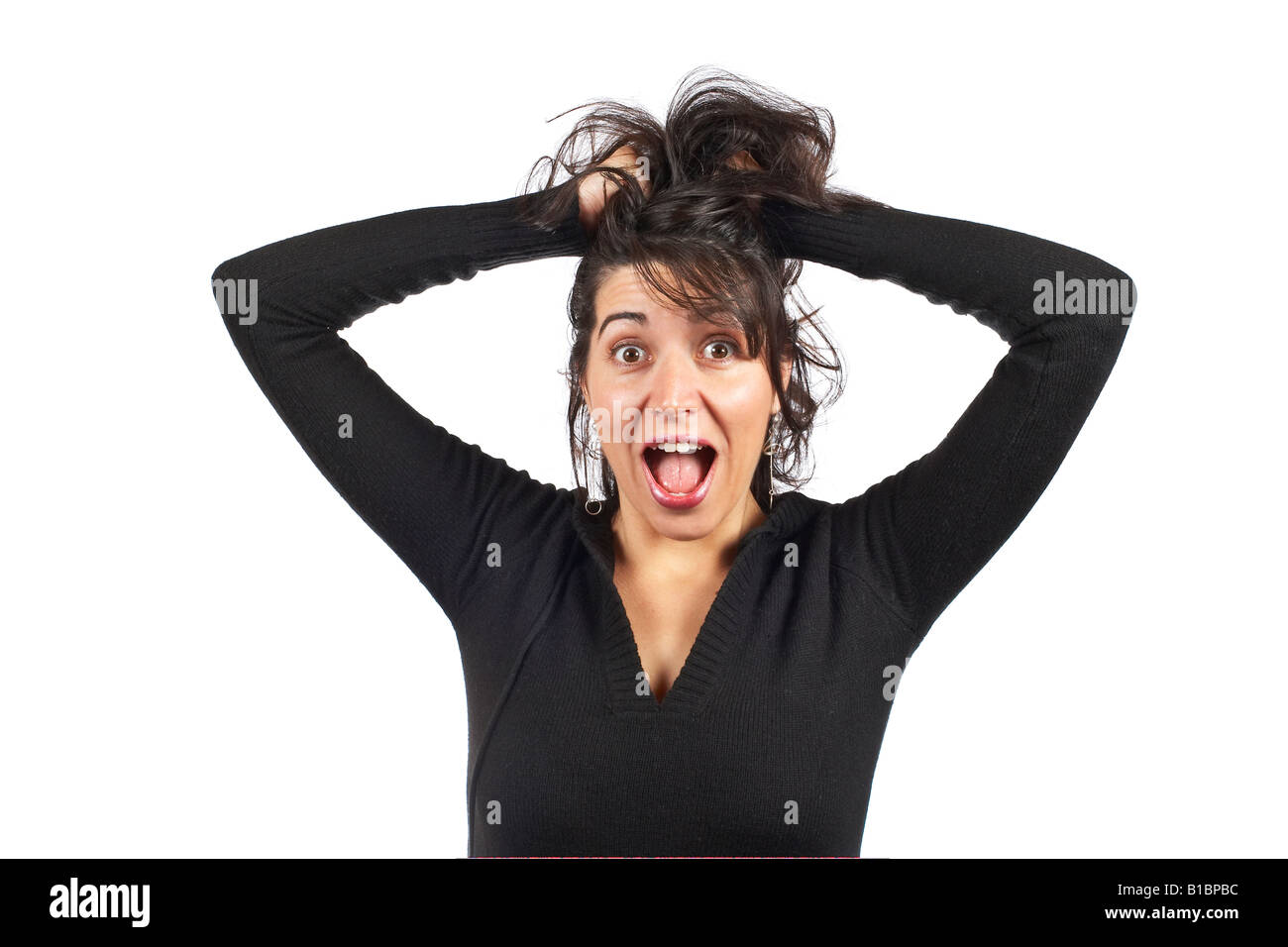Angered casual woman over a white background Stock Photo - Alamy