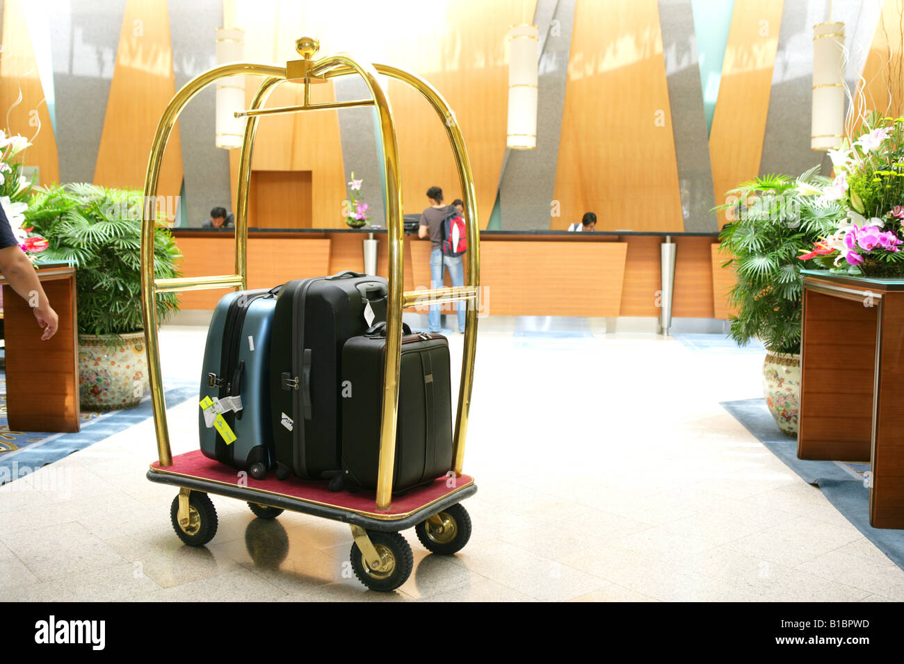 luggage cart,hotel reception in background Stock Photo - Alamy