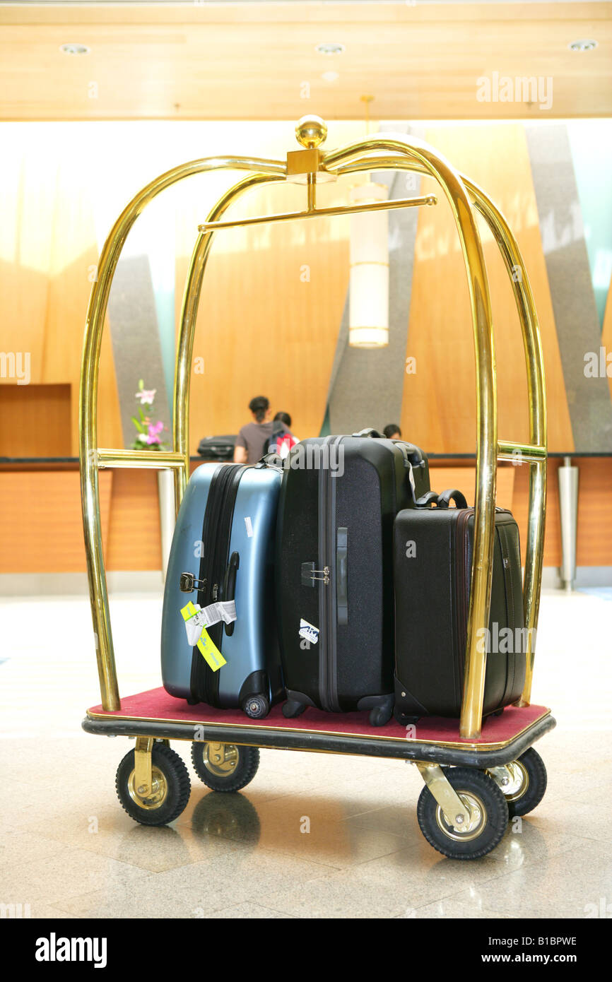 luggage cart,hotel reception in background Stock Photo - Alamy