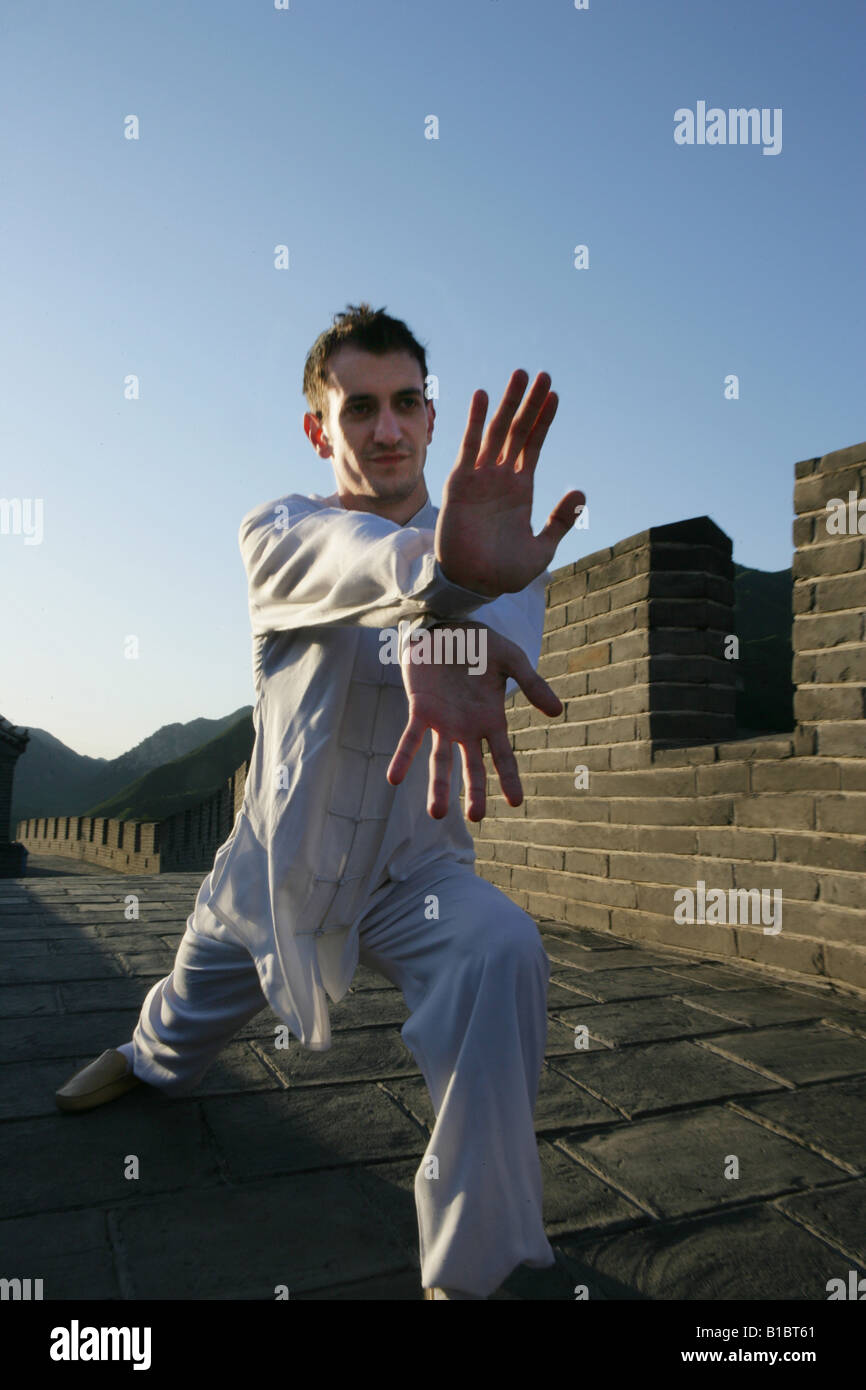 caucasian in Chinese traditional clothing practising martial arts on ...