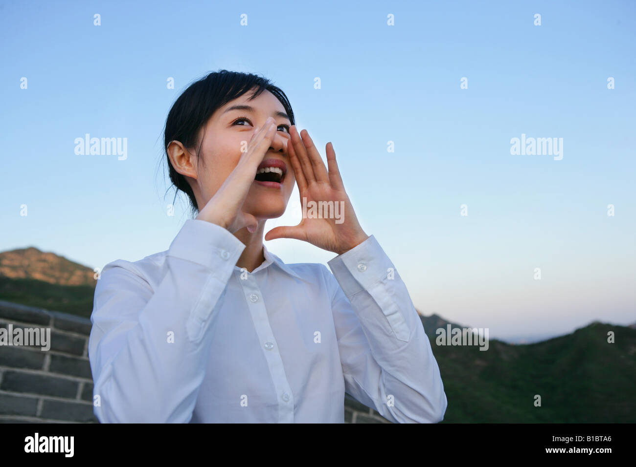 businesswoman shouting on Great Wall,Beijing,China Stock Photo - Alamy