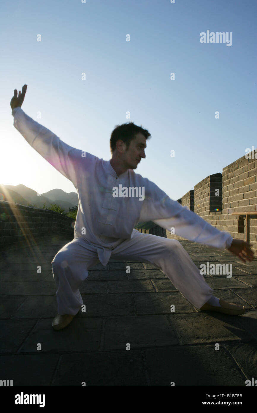 caucasian in Chinese traditional clothing practising martial arts on ...