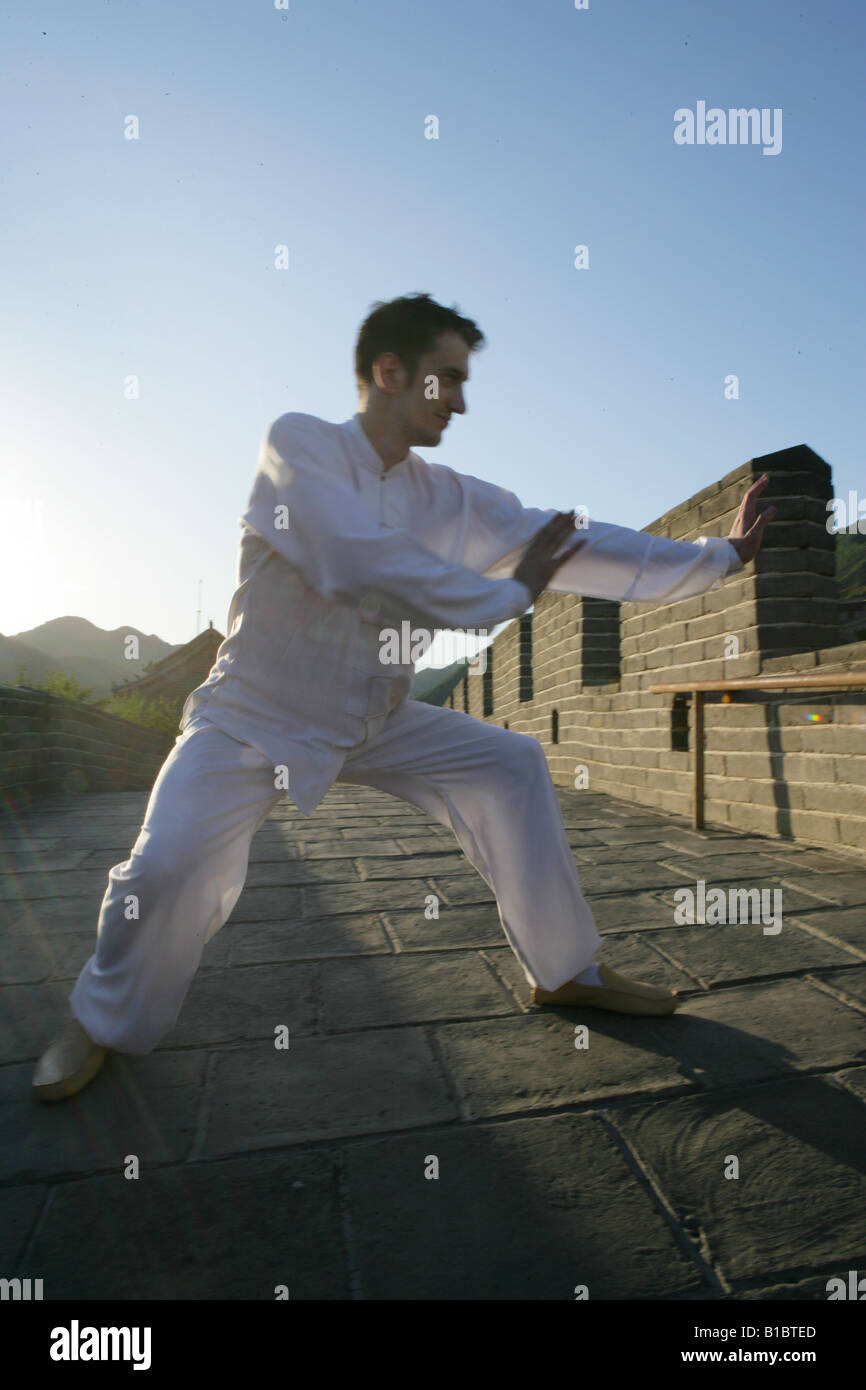 caucasian in Chinese traditional clothing practising martial arts on ...