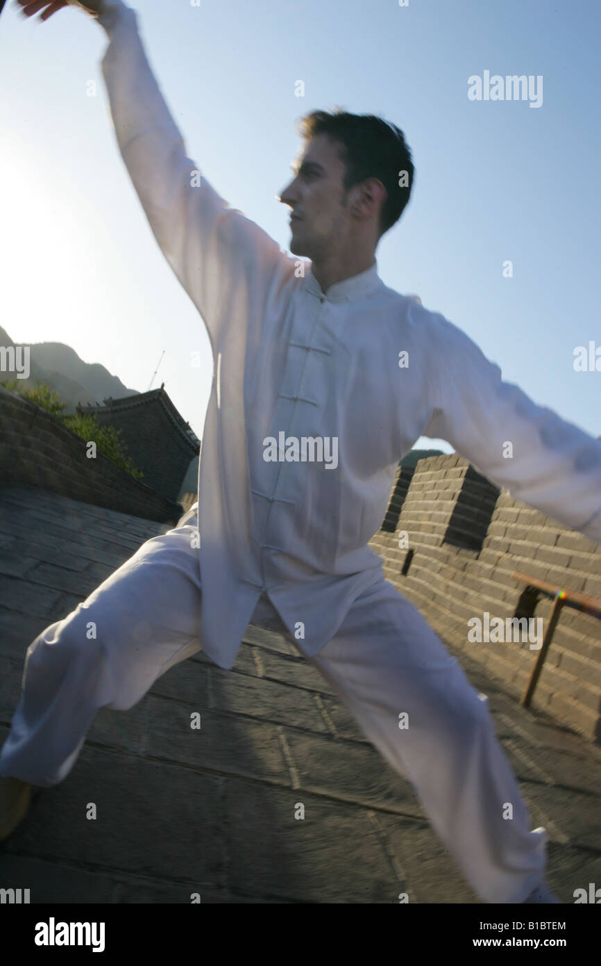 caucasian in Chinese traditional clothing practising martial arts on ...