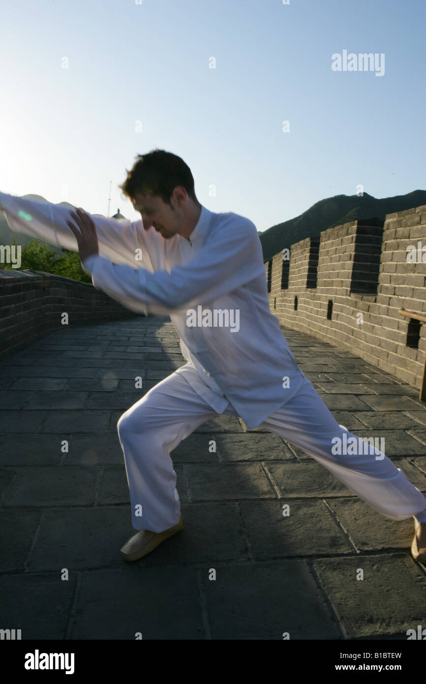 caucasian in Chinese traditional clothing practising martial arts on ...