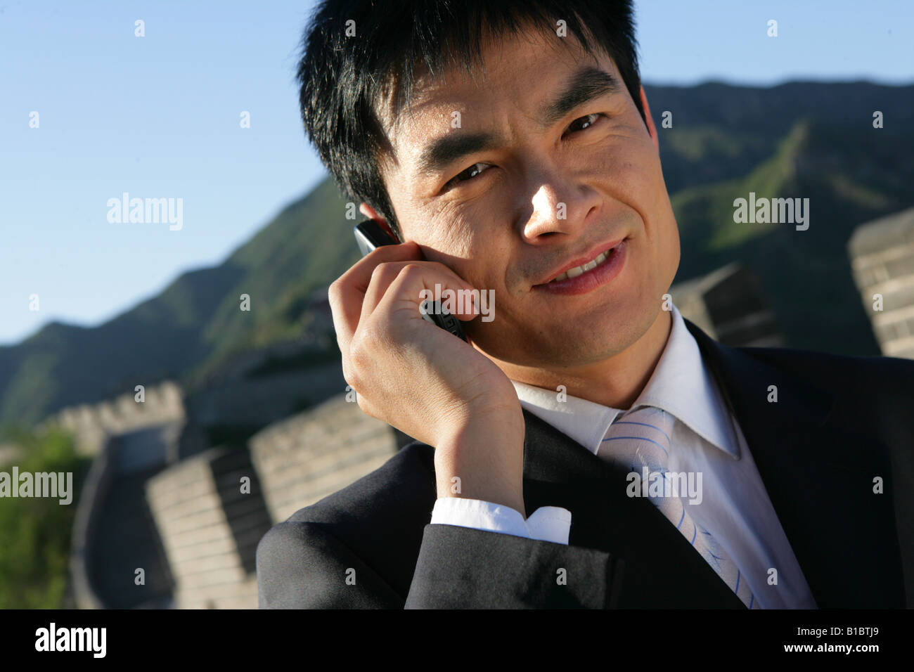 businessman calling on Great Wall,Beijing,China Stock Photo - Alamy