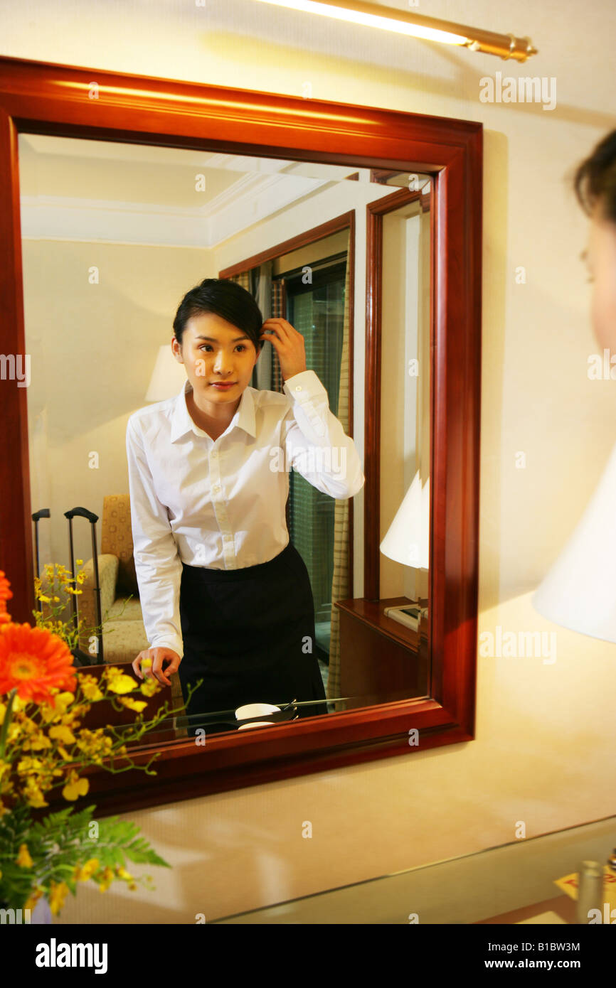 young woman preparing for departing in hotel room Stock Photo - Alamy