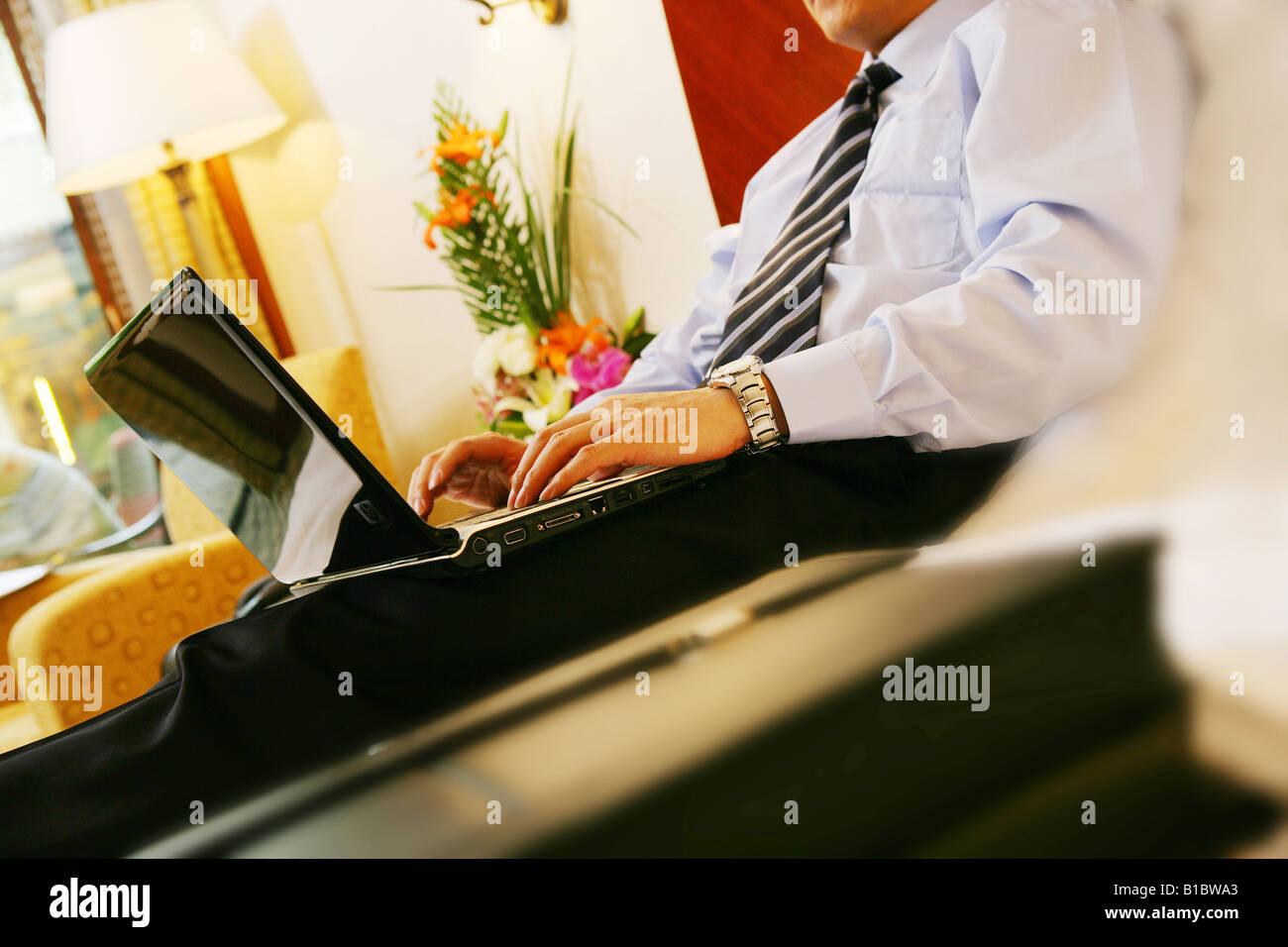 businessman using laptop in hotel room Stock Photo - Alamy